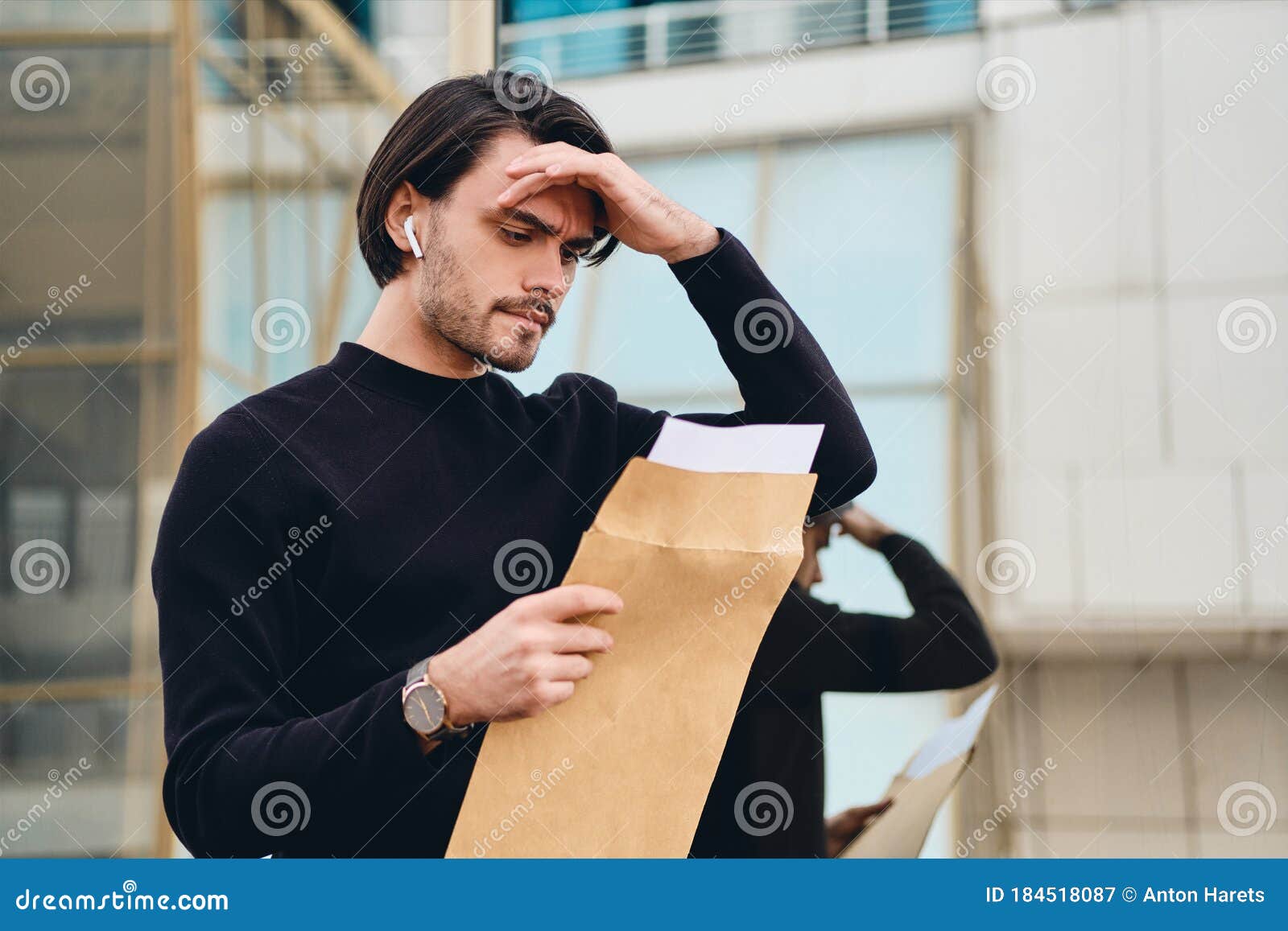 Young Sad Man Thoughtfully Reading Envelope with Response Outdoor Stock ...