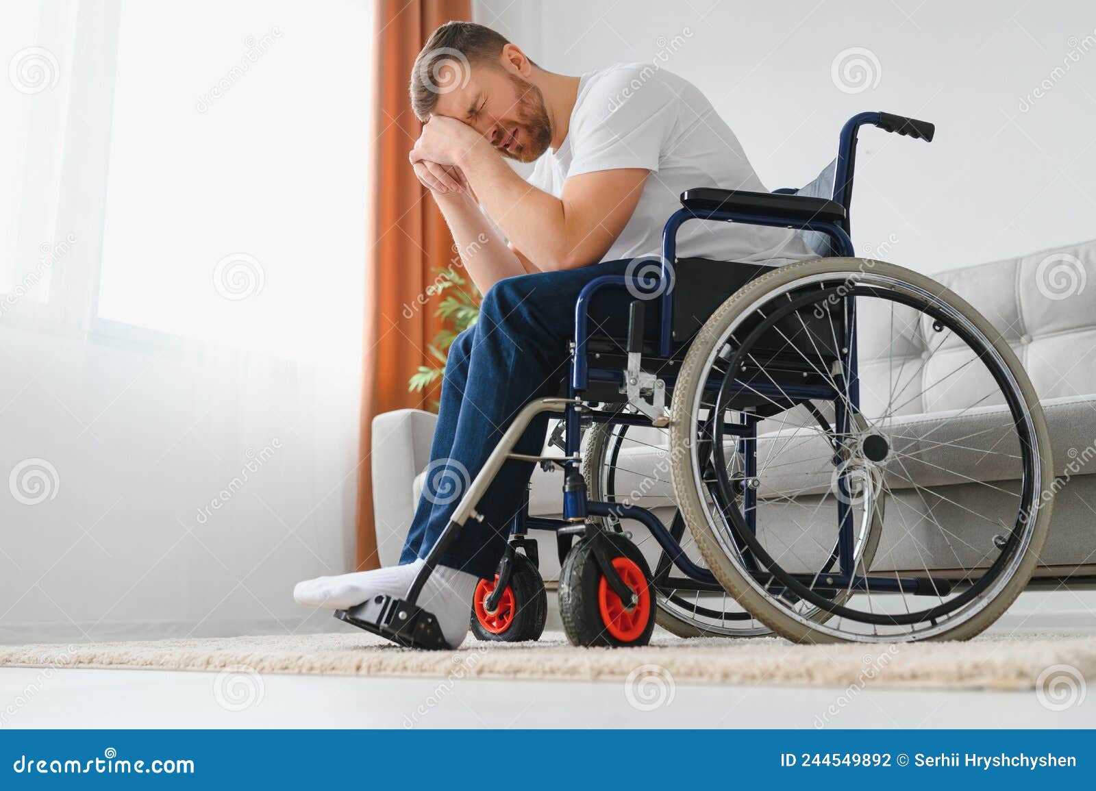 Young Sad Man in a Wheelchair at Home Stock Photo - Image of injury ...