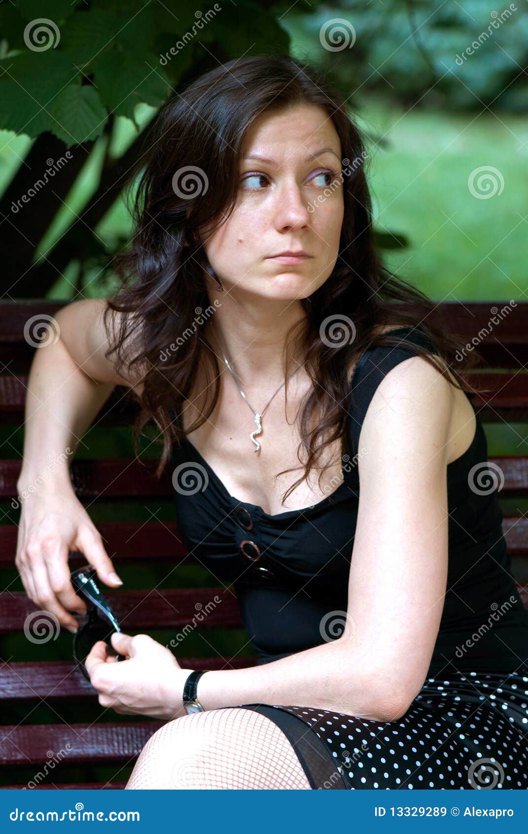 Young Sad Woman Sitting Outdoors Stock Image - Image of park, reverie ...