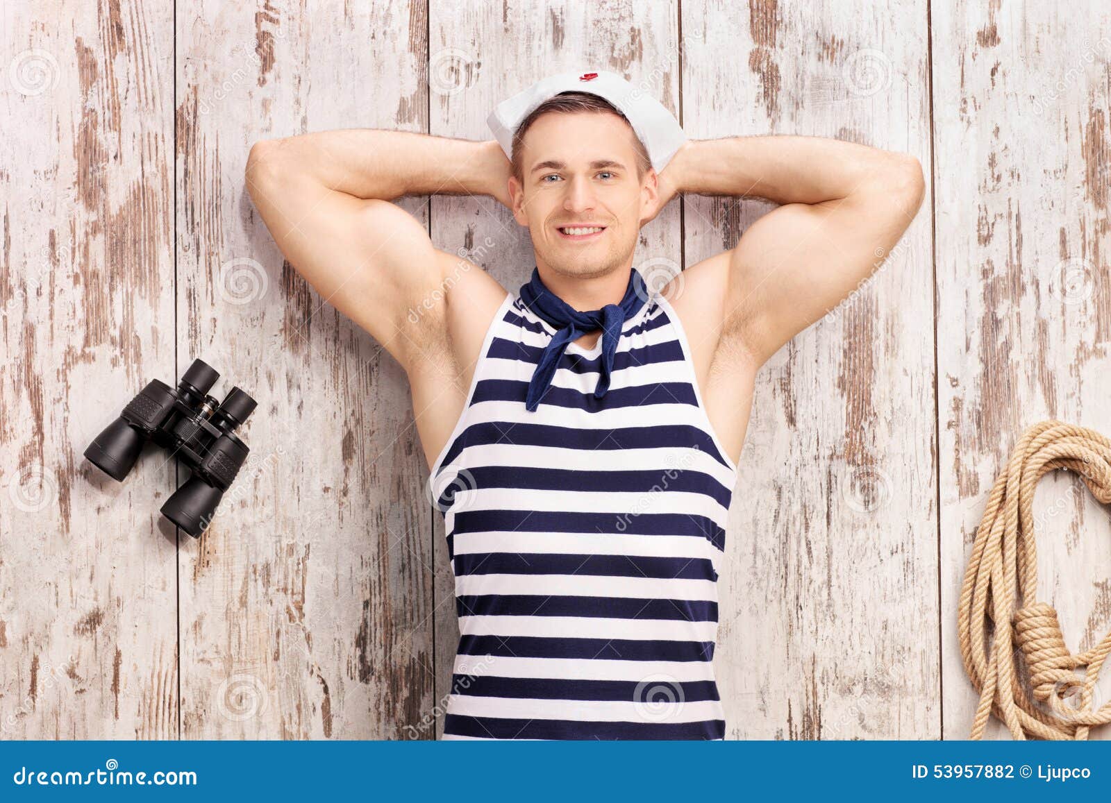 Young Sailor Lying on Deck and Smiling Stock Photo - Image of ...