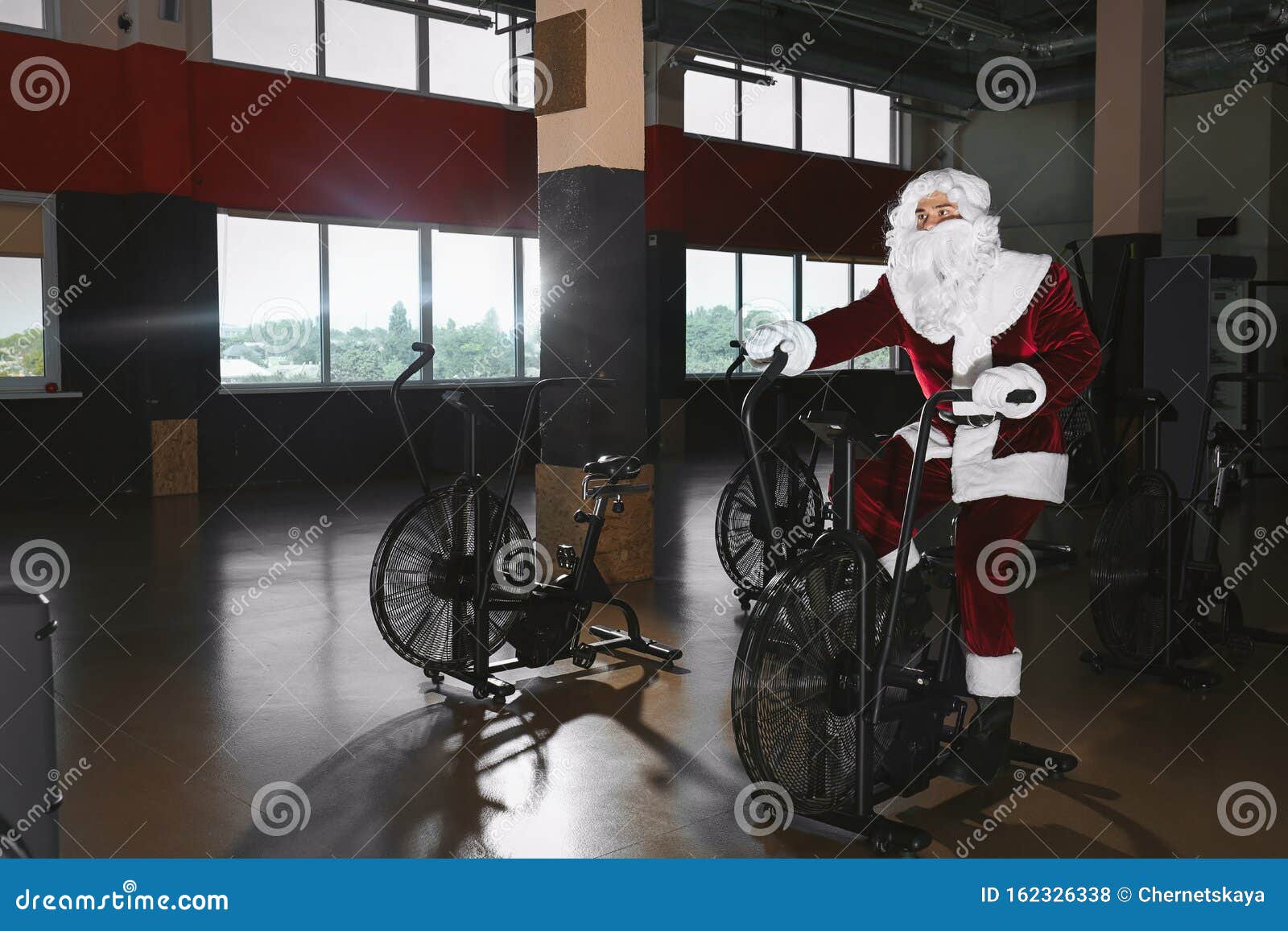 Young Santa Claus Training in Gym Stock Photo - Image of club, machine ...