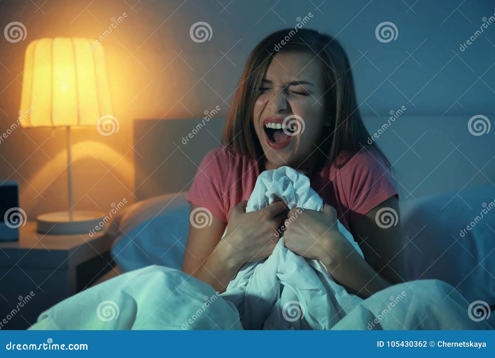 Young Scared Woman Sitting on Bed Stock Photo - Image of problem ...