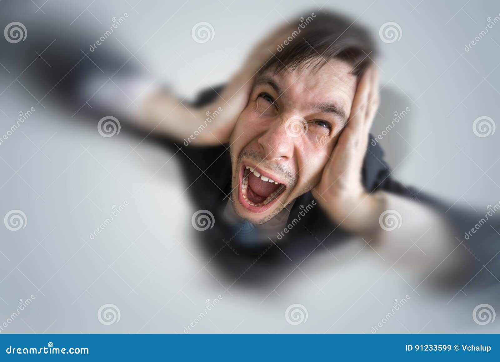 Young Schizophrenic Man Suffers from Headache and Covering His Ears ...