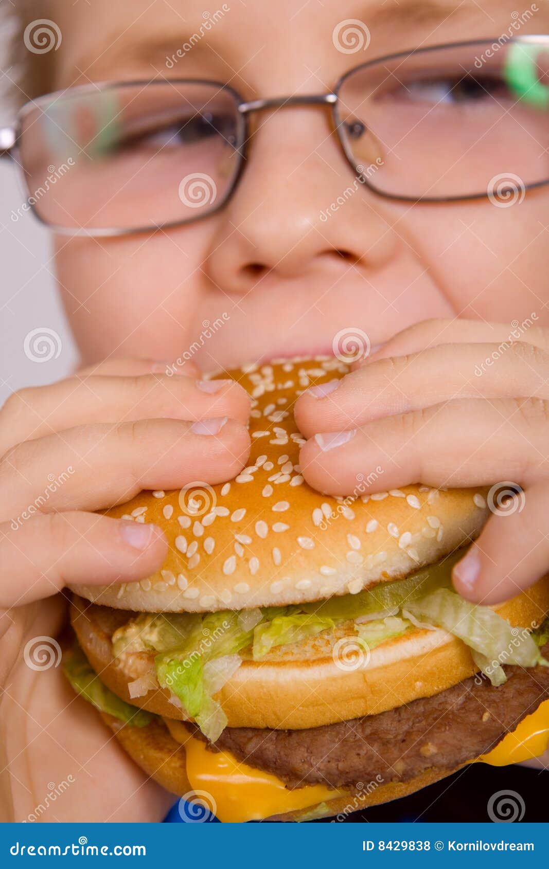 Young School Boy Eating Hamburger Stock Photo - Image of delicious ...