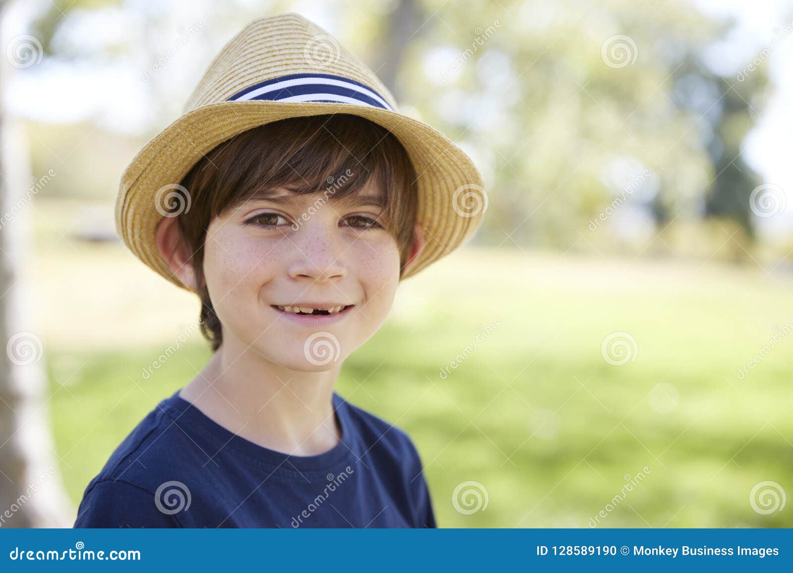 Young Schoolboy in a Sun Hat Smiling To Camera, Portrait Stock Photo ...