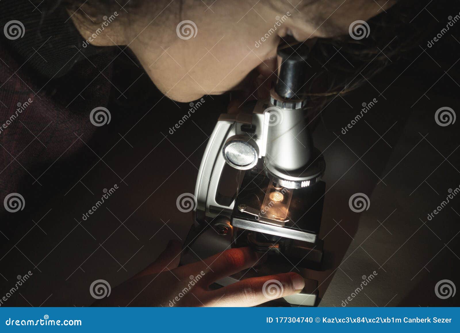 Young Science Student Looking through His Microscope Stock Photo ...