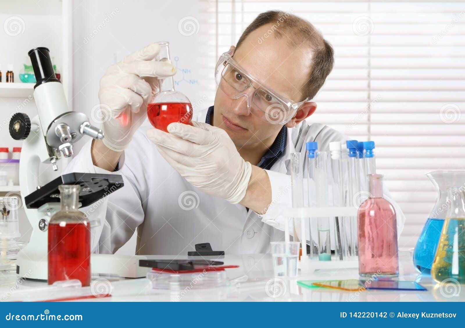 A Young Scientist Conducting Research in a Laboratory Stock Photo ...