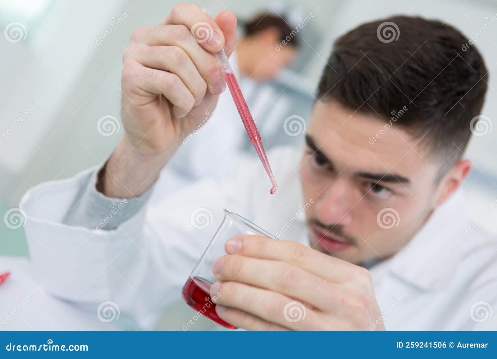 Young Scientist Dripping Liquid from Pipette Stock Photo - Image of ...