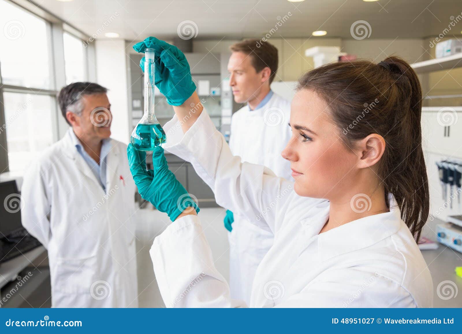 Young Scientist Holding Up Test Tube Stock Image - Image of caucasian ...