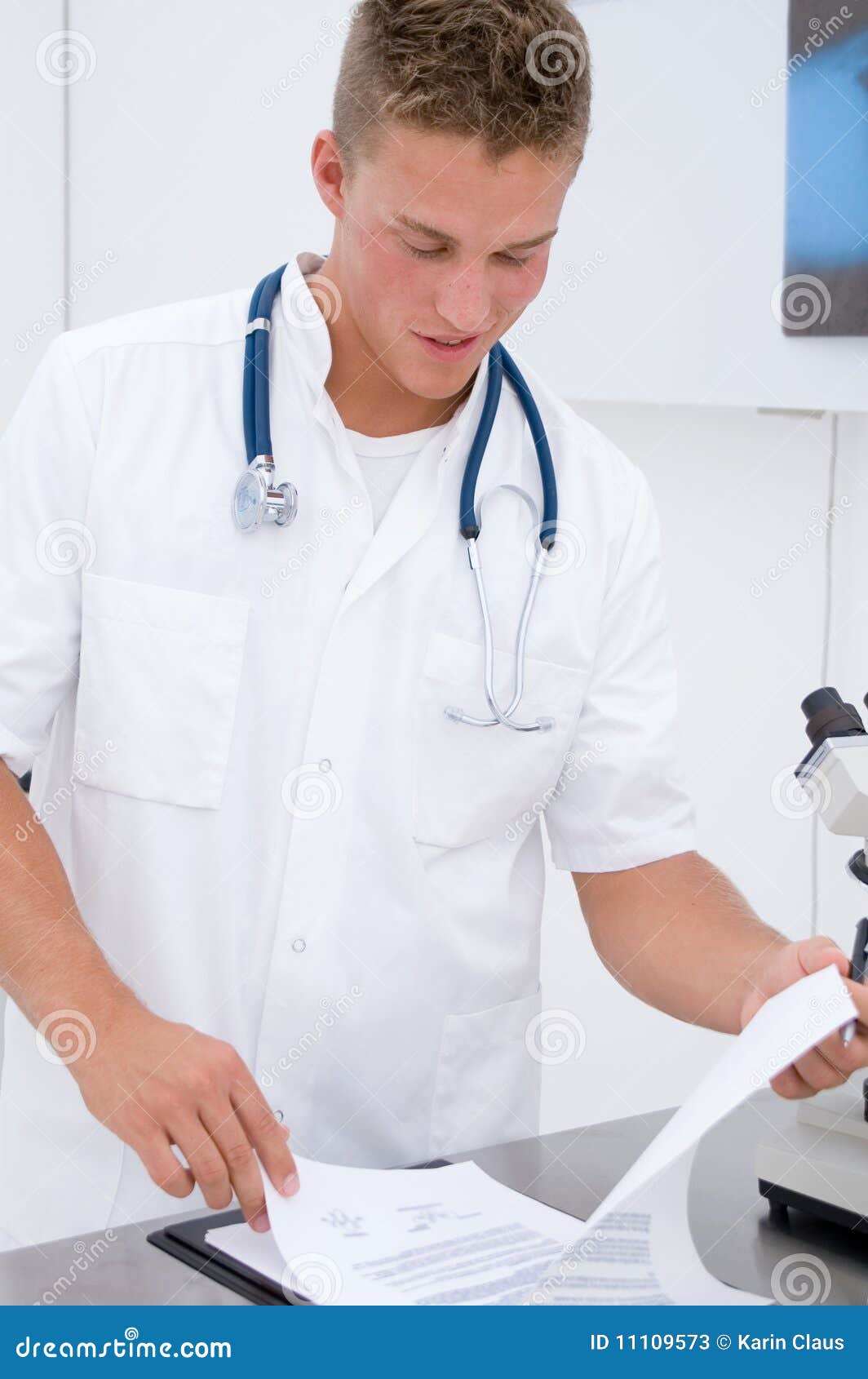 Young Scientist Looking at Data Sheet Results Stock Image - Image of ...