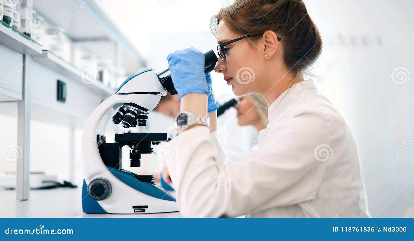 Young Scientist Looking through Microscope in Laboratory Stock Photo - Image of genetic ...