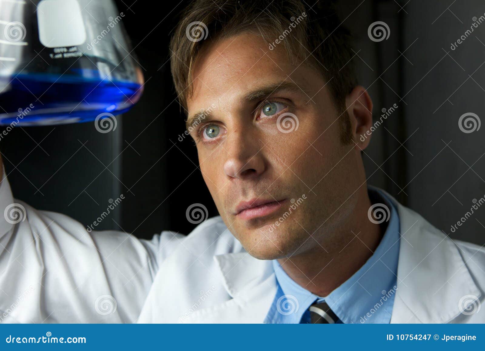 Young Scientist Performing Experiment Stock Image - Image of male ...