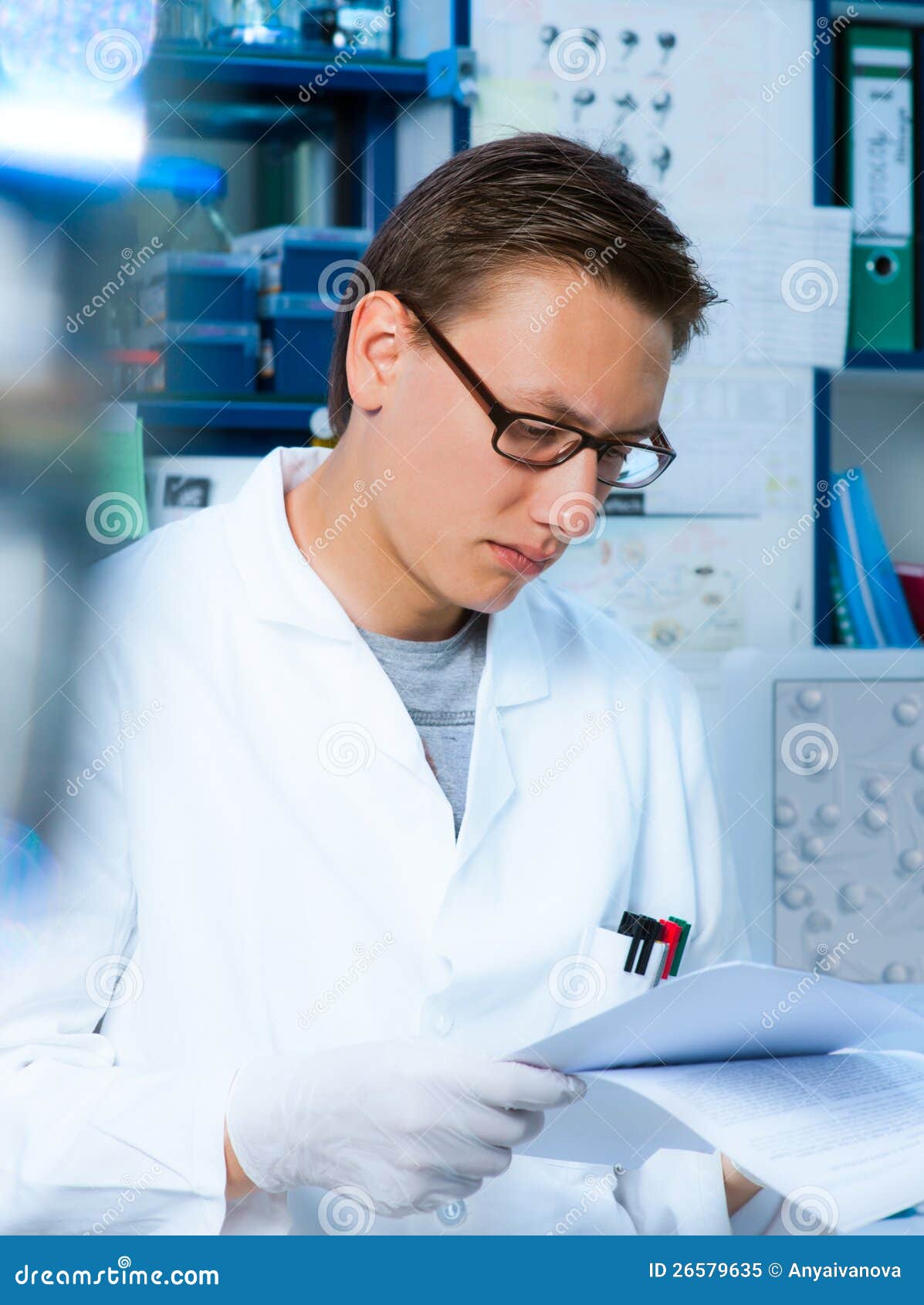 Young scientist reading stock image. Image of bottle - 26579635