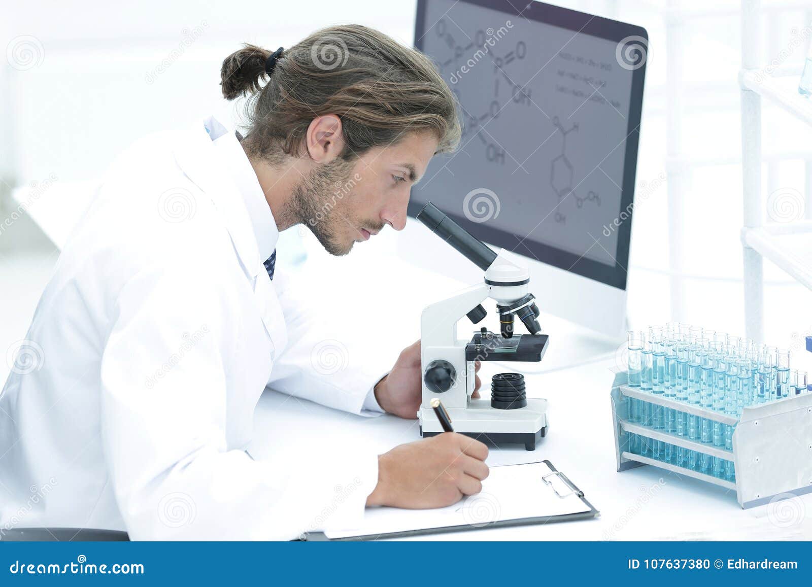 Laboratory Worker Sitting by Table with Microscope Stock Photo - Image ...