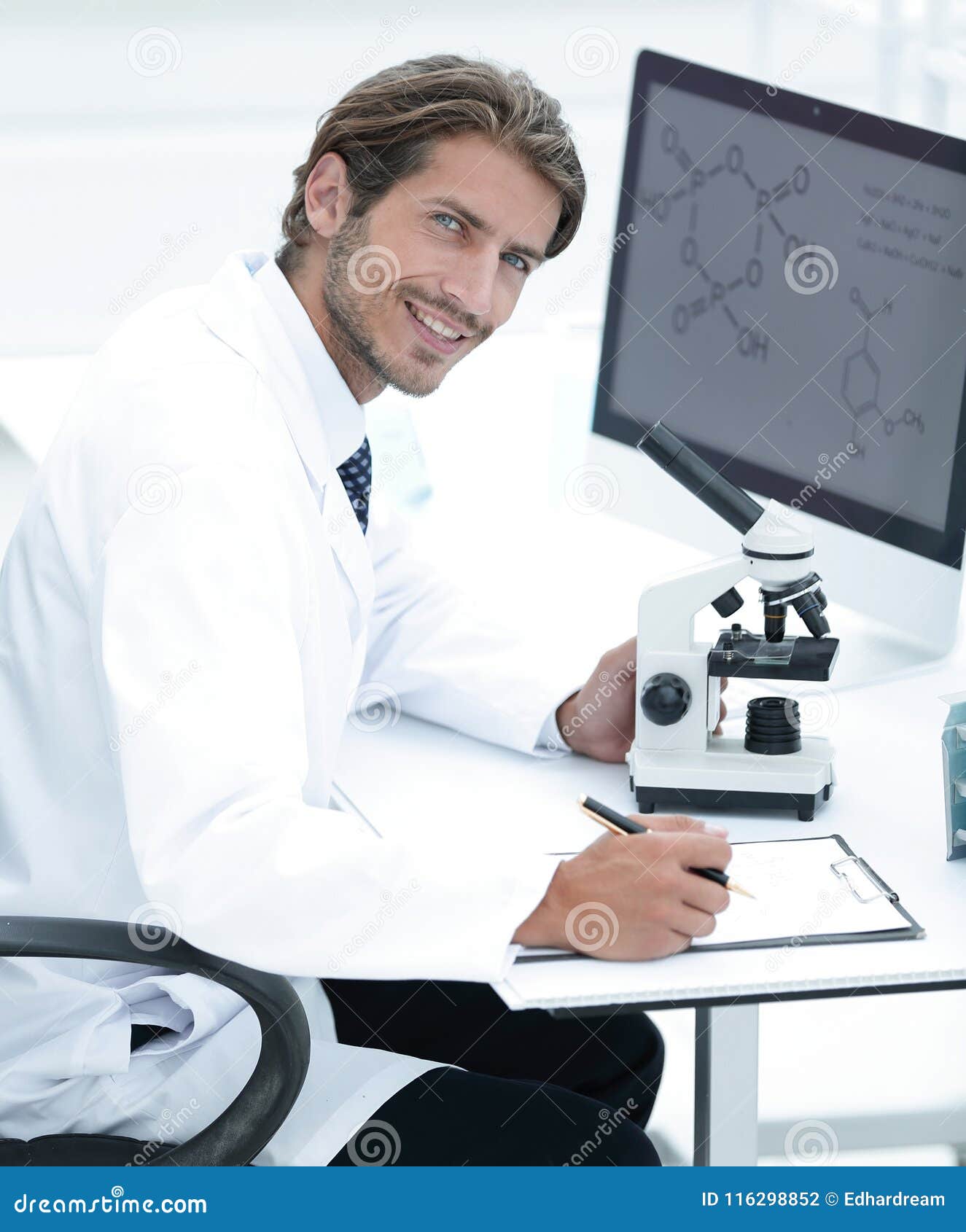 Laboratory Worker Sitting by Table with Microscope Stock Photo - Image ...