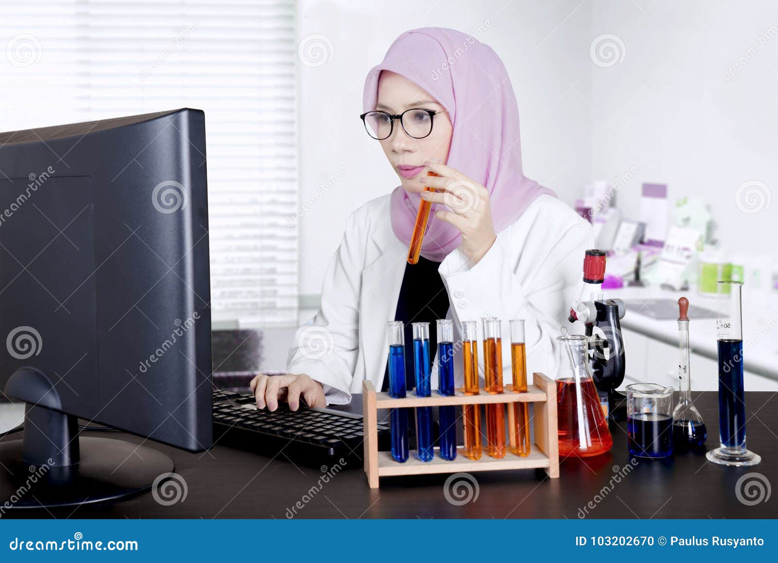 Young Scientist Using Computer in the Lab Stock Photo - Image of islam ...