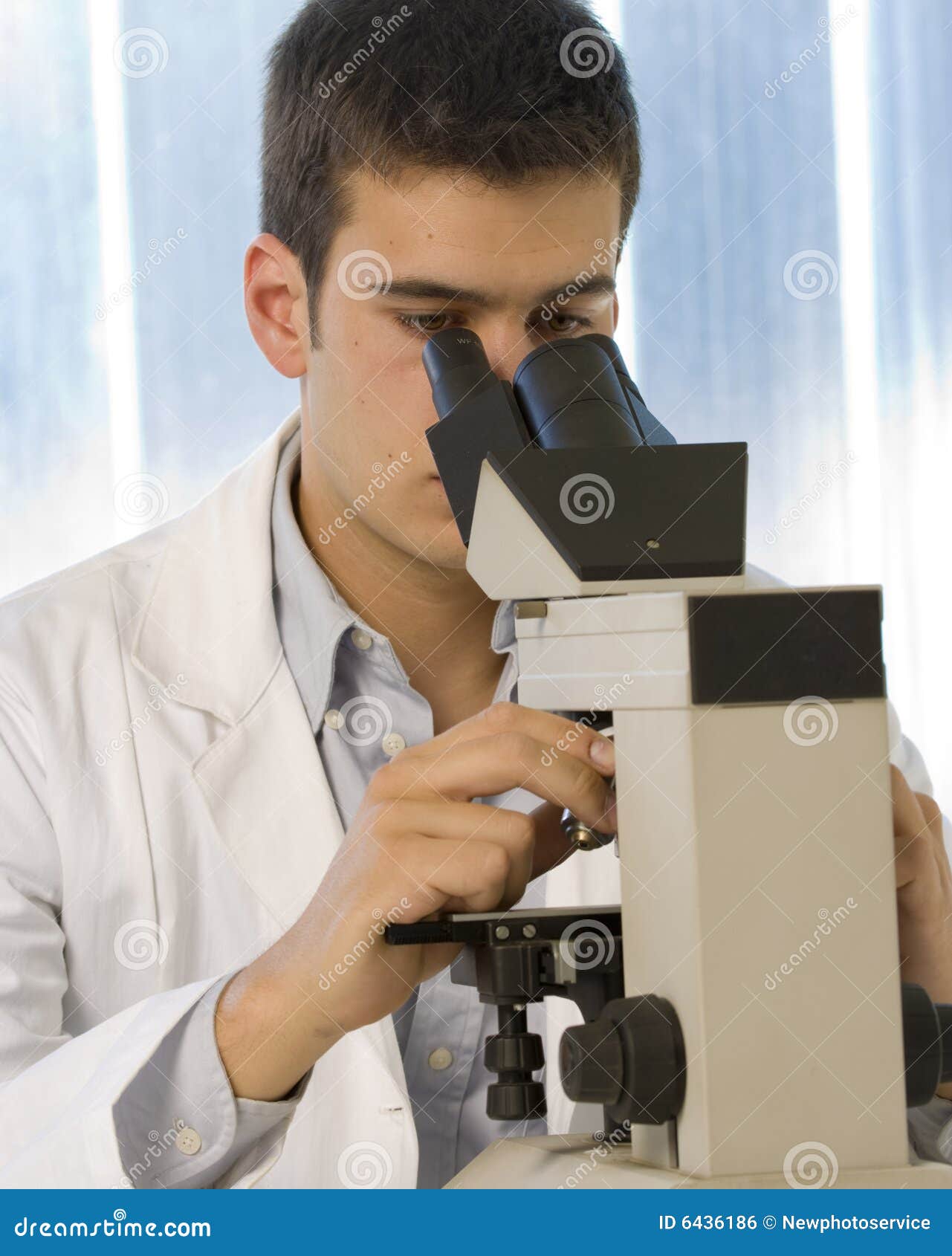 Young Scientist Watching Inside a Microscope Stock Photo - Image of ...