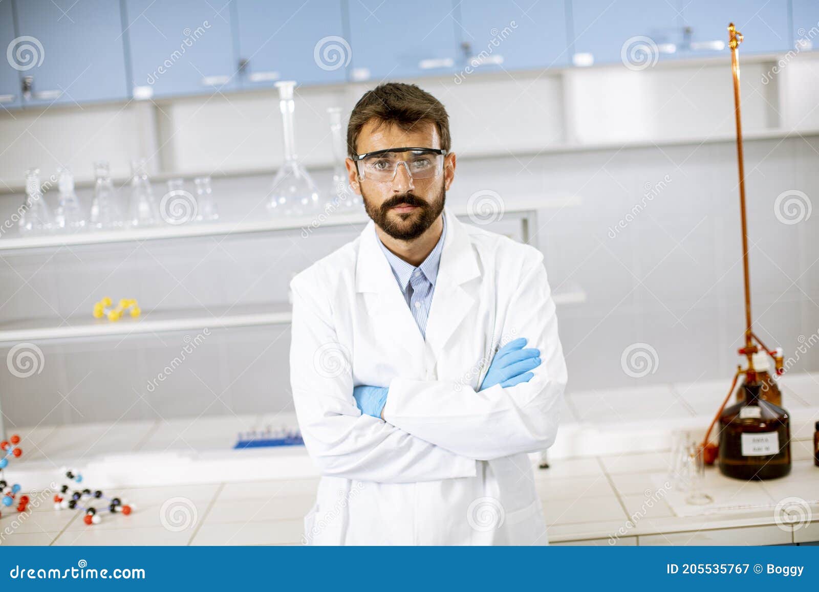 Young Scientist in White Lab Coat Standing in the Biomedical Lab Stock ...