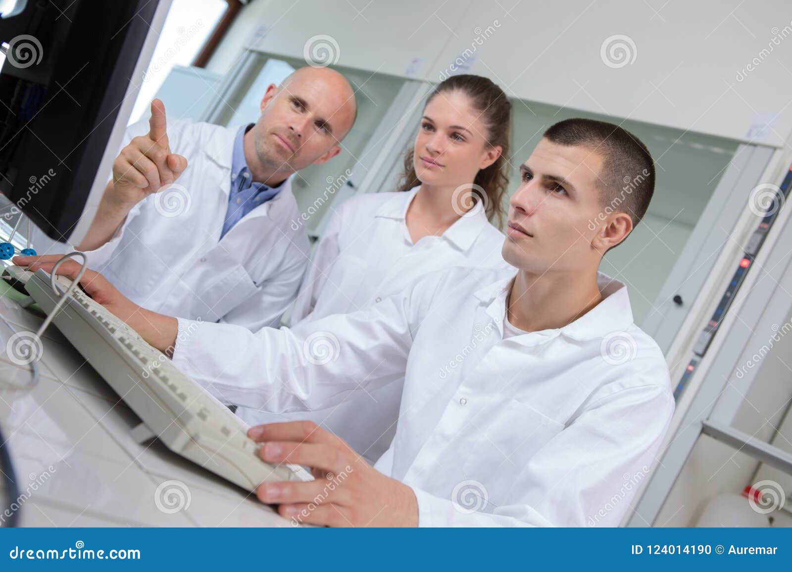 Young Scientist Working on Computer Teacher Pointing To Screen Stock ...