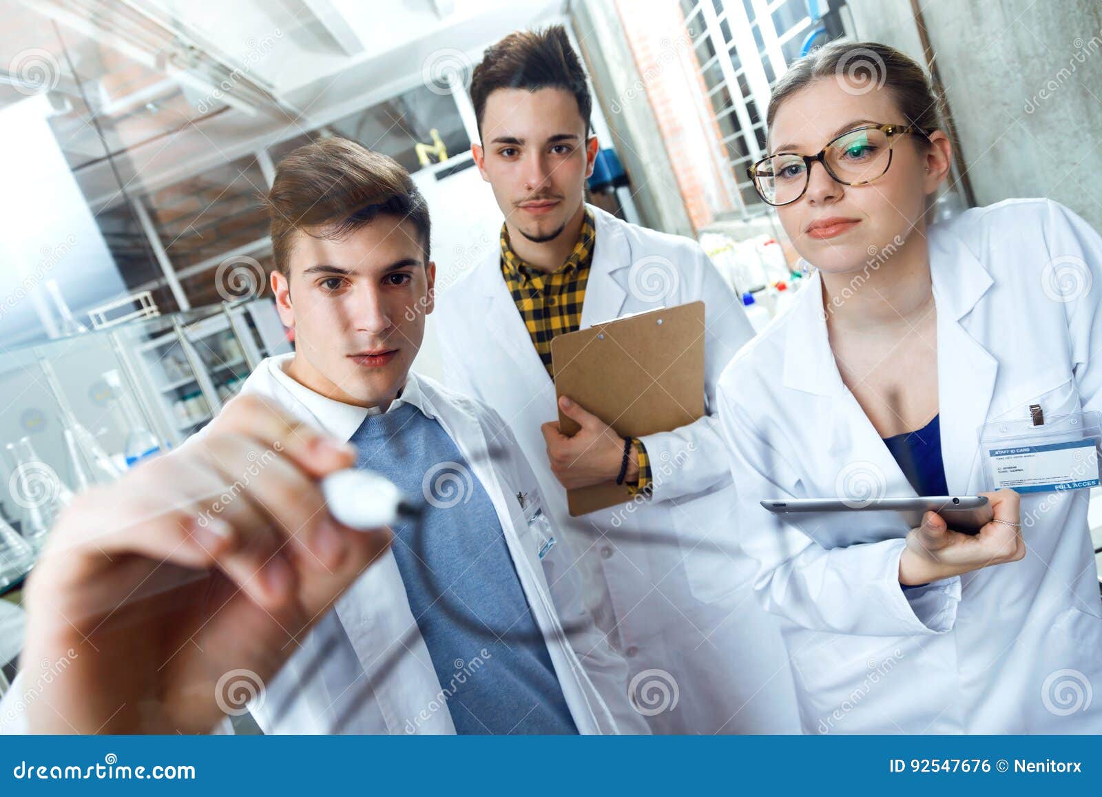 Young Scientists Carrying Out an Experiment in a Laboratory. Stock ...