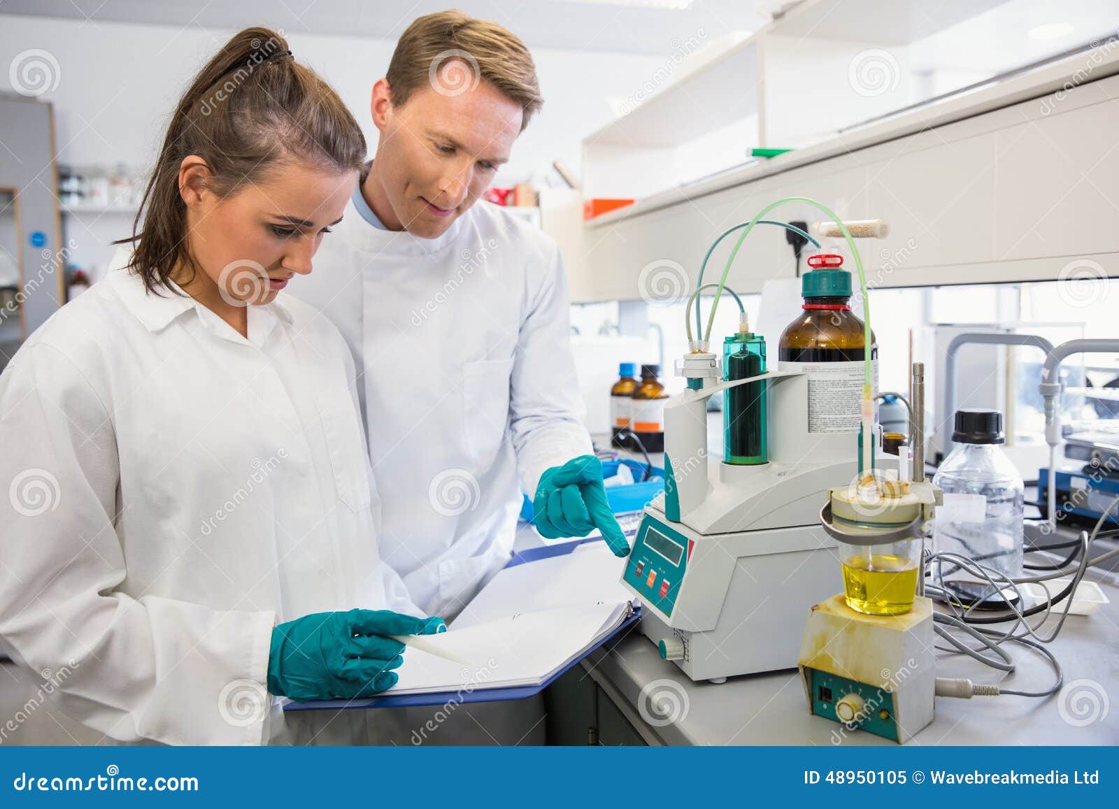 Young Scientists Conducting an Experiment Together Stock Image - Image ...