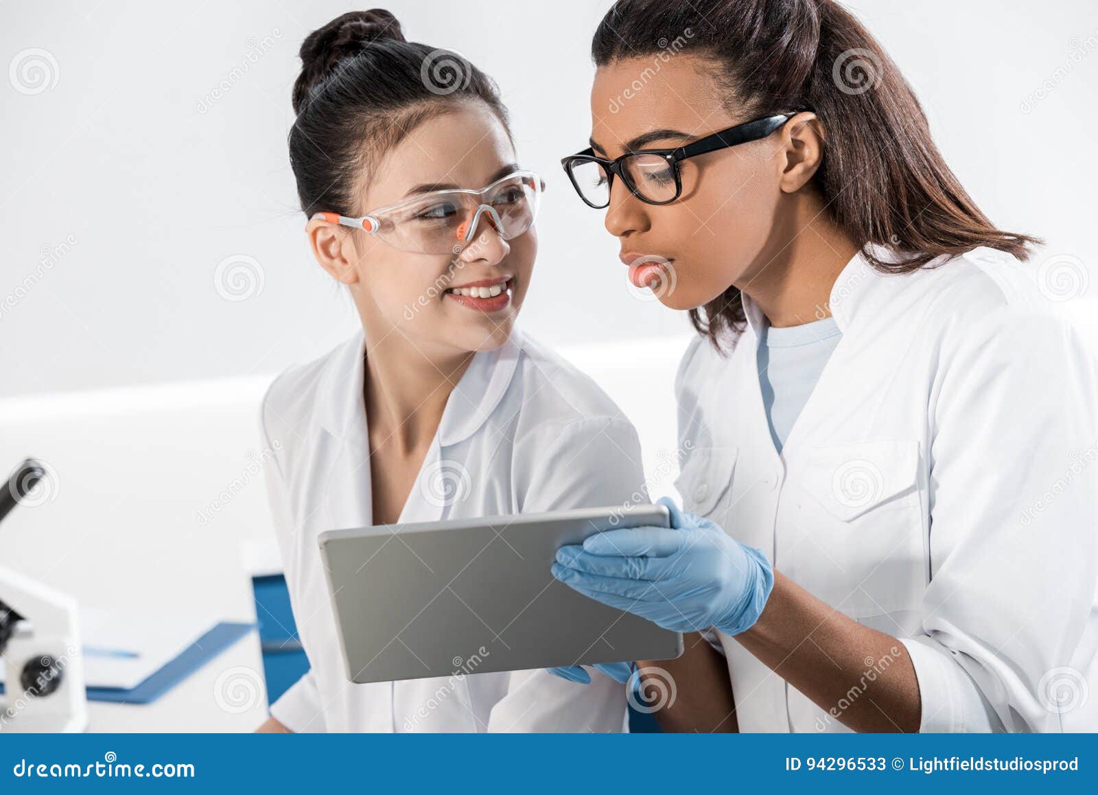 Young Scientists in Eyeglasses Using Digital Tablet in Laboratory ... Young Scientists in Eyeglasses Using Digital Tablet in Laboratory ...