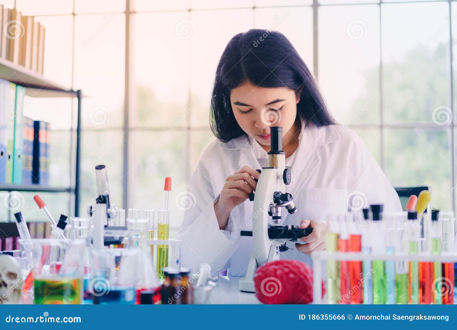 Young Scientists Look through the Microscope in the Laboratory To ...