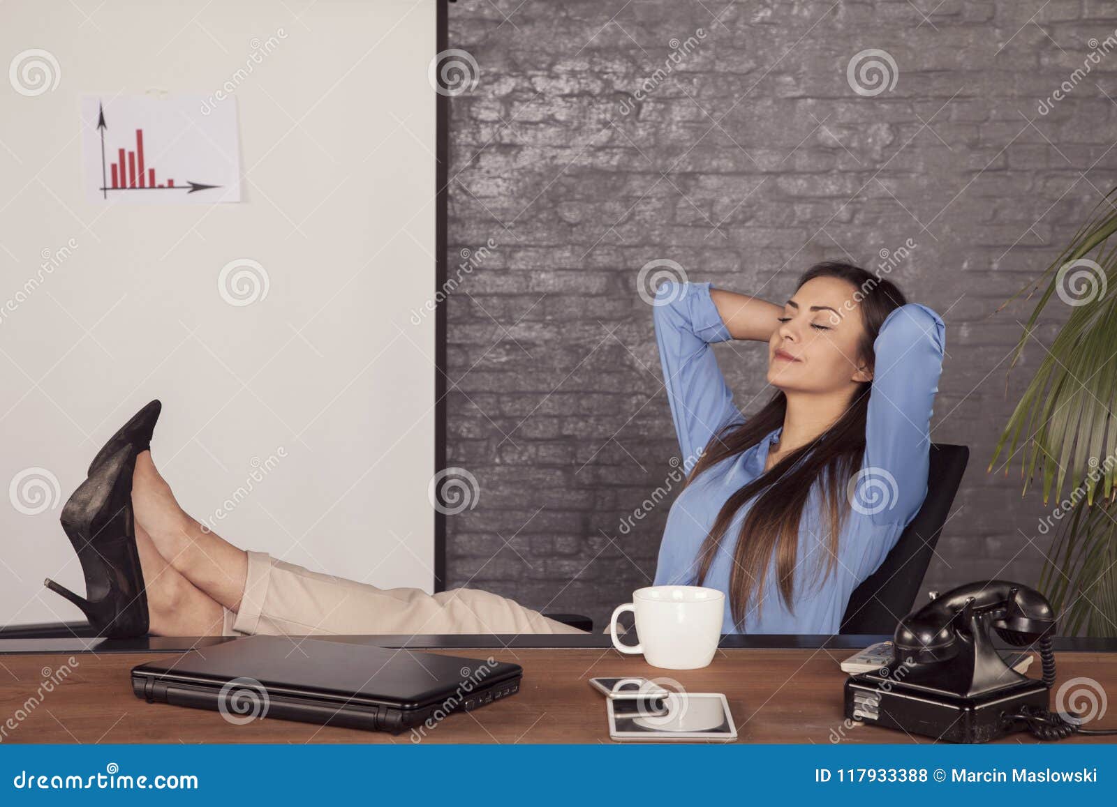 A Young Secretary Enjoys a Free Moment, Rest at Work Stock Photo ...