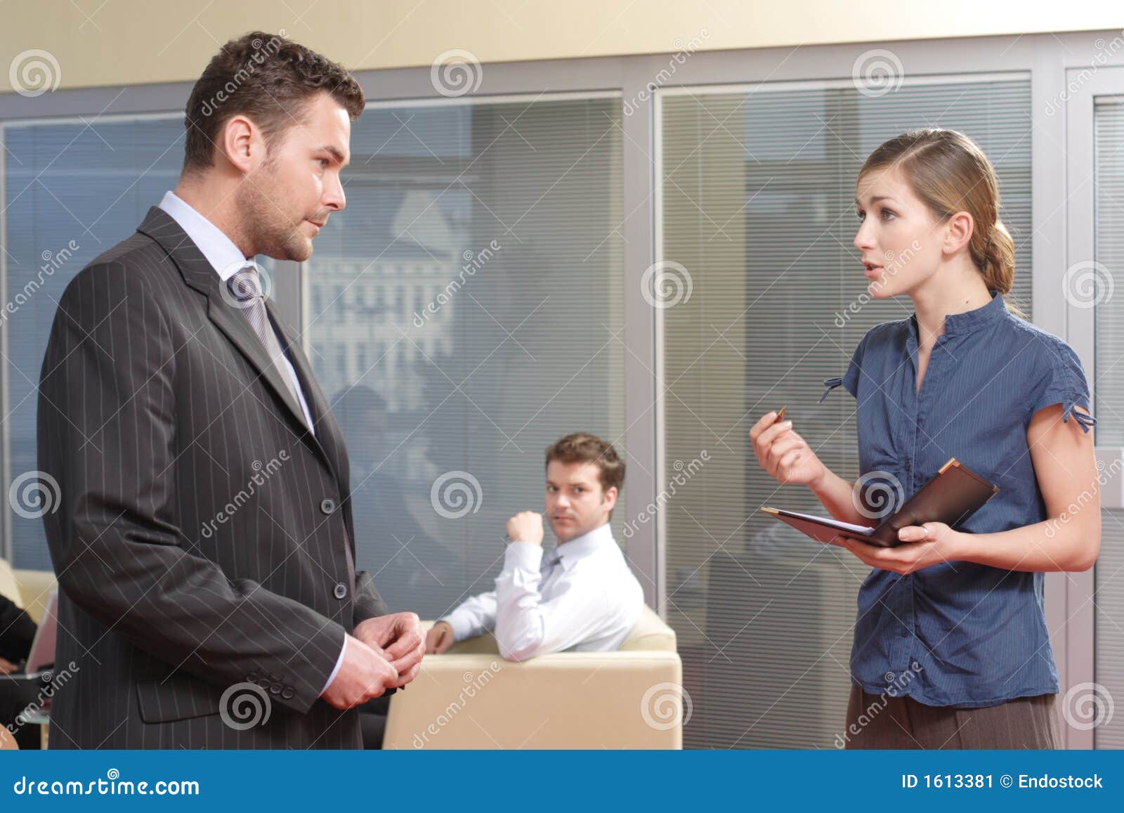 Young Secretary Talking To Her Boss in the Office Stock Image - Image ...