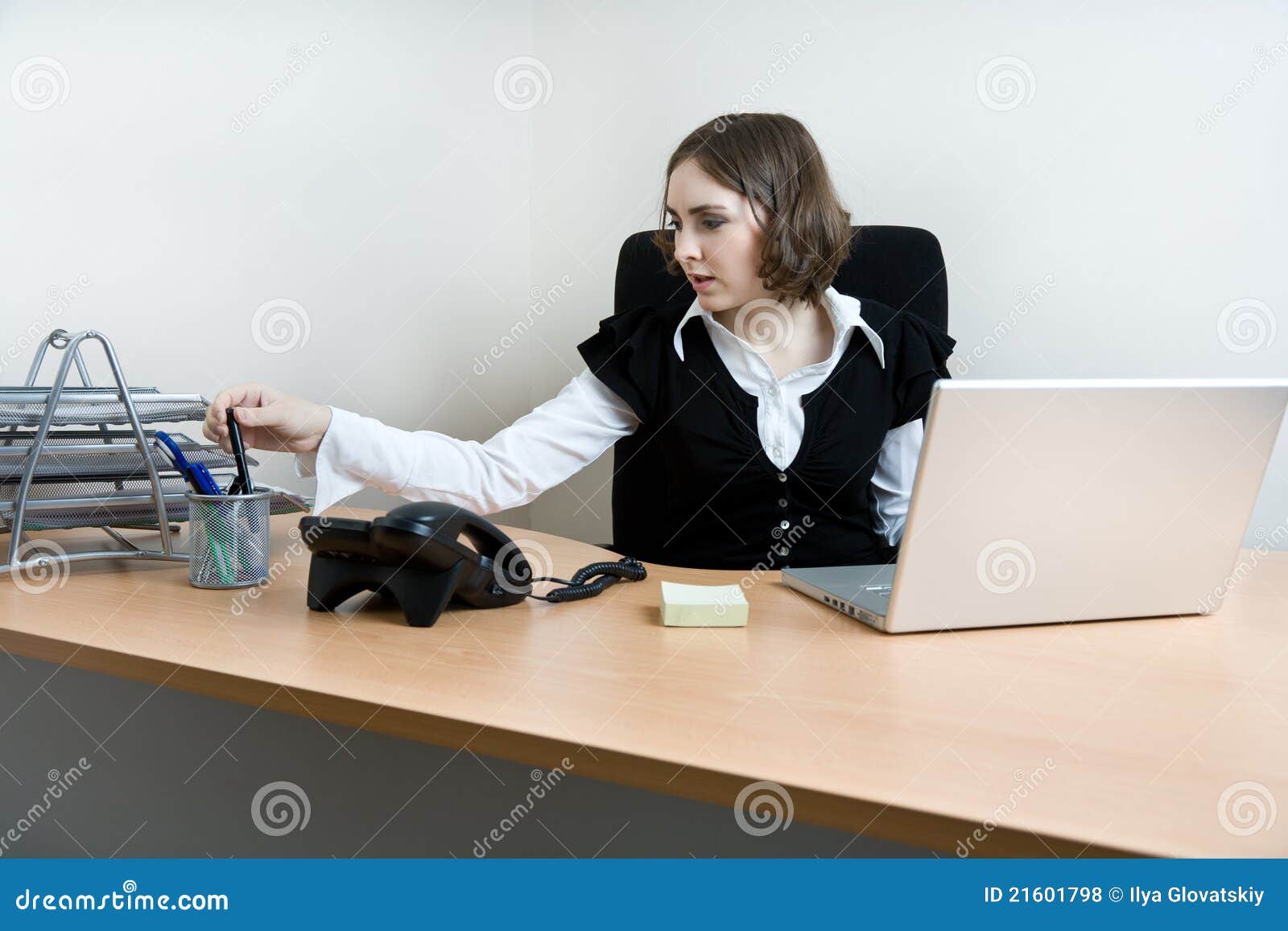 Young Secretary with Telephone and Laptop Stock Photo - Image of ...