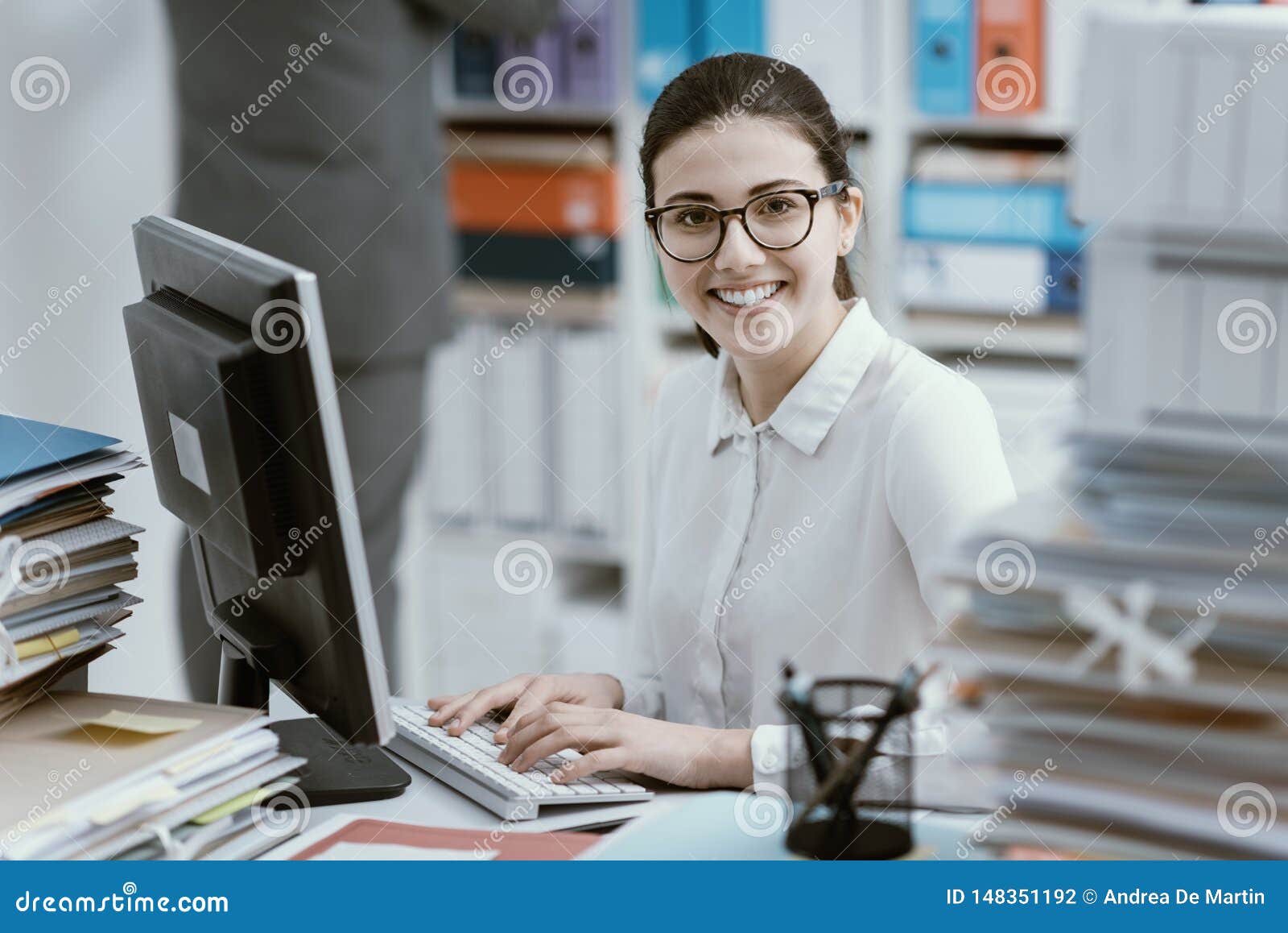 Young Secretary Working and Smiling Stock Photo - Image of glasses ...