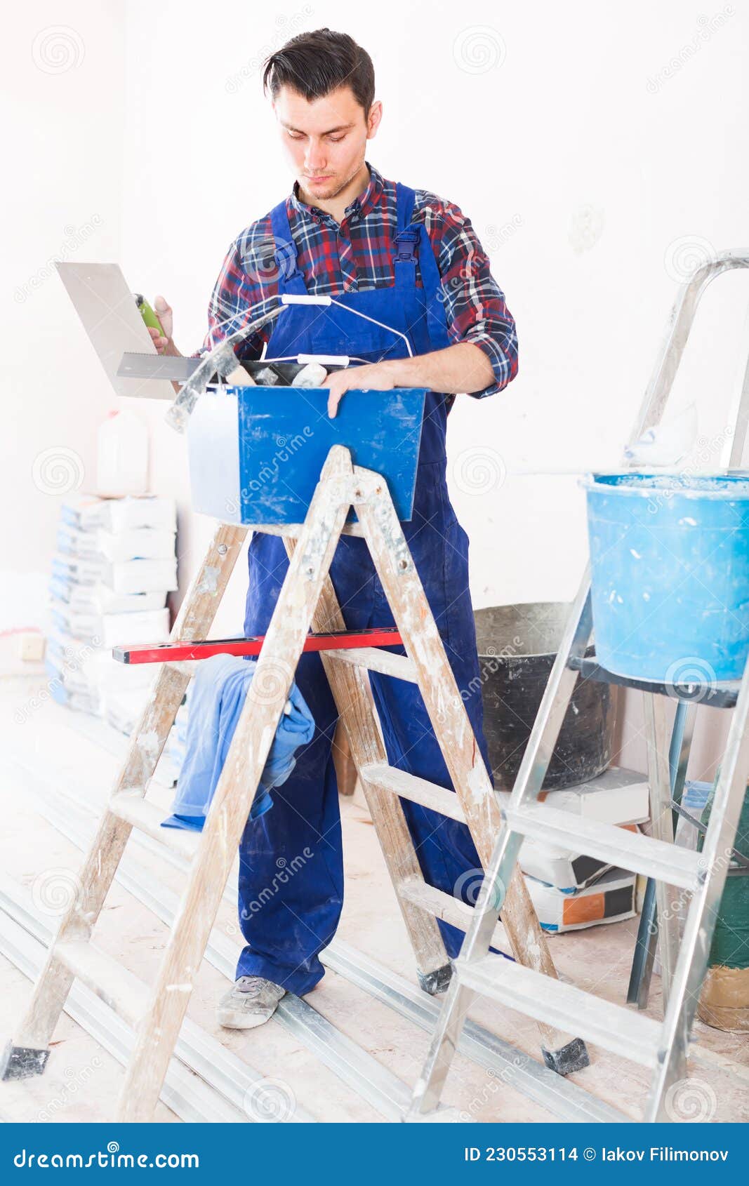 Young Serious Builder Handyman Choosing Tool in Toolbox Stock Photo ...