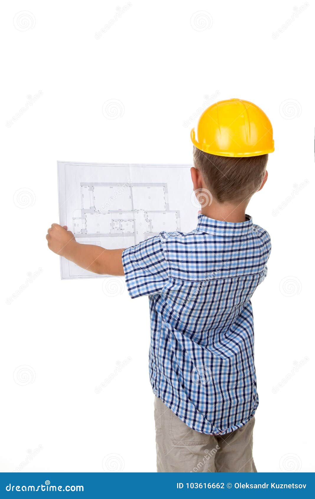 Young Serious Builder Reading a Construction Plan, Turned Back ...