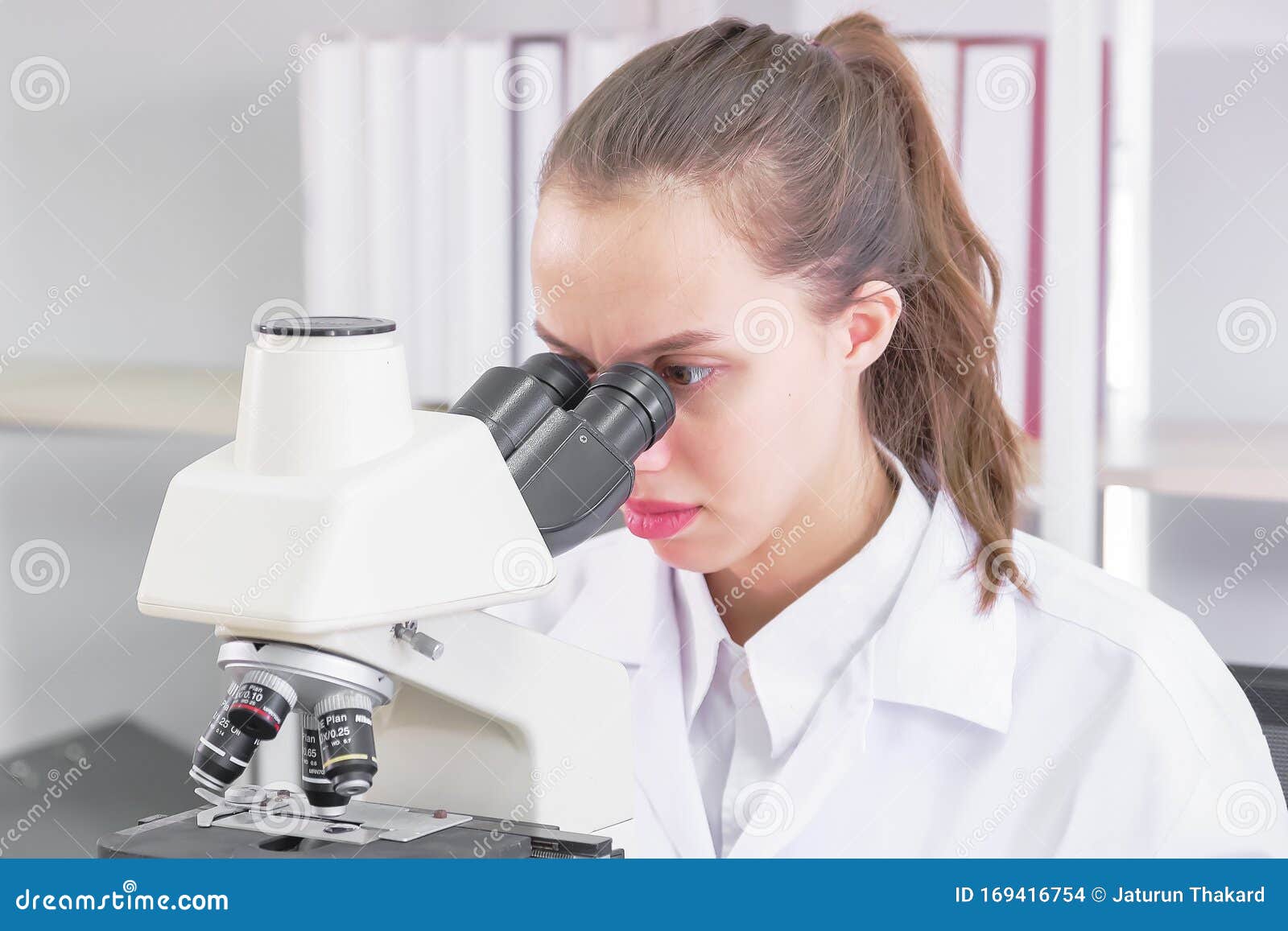 Young Serious Female Scientist Researcher Using Microscope Stock Photo ...