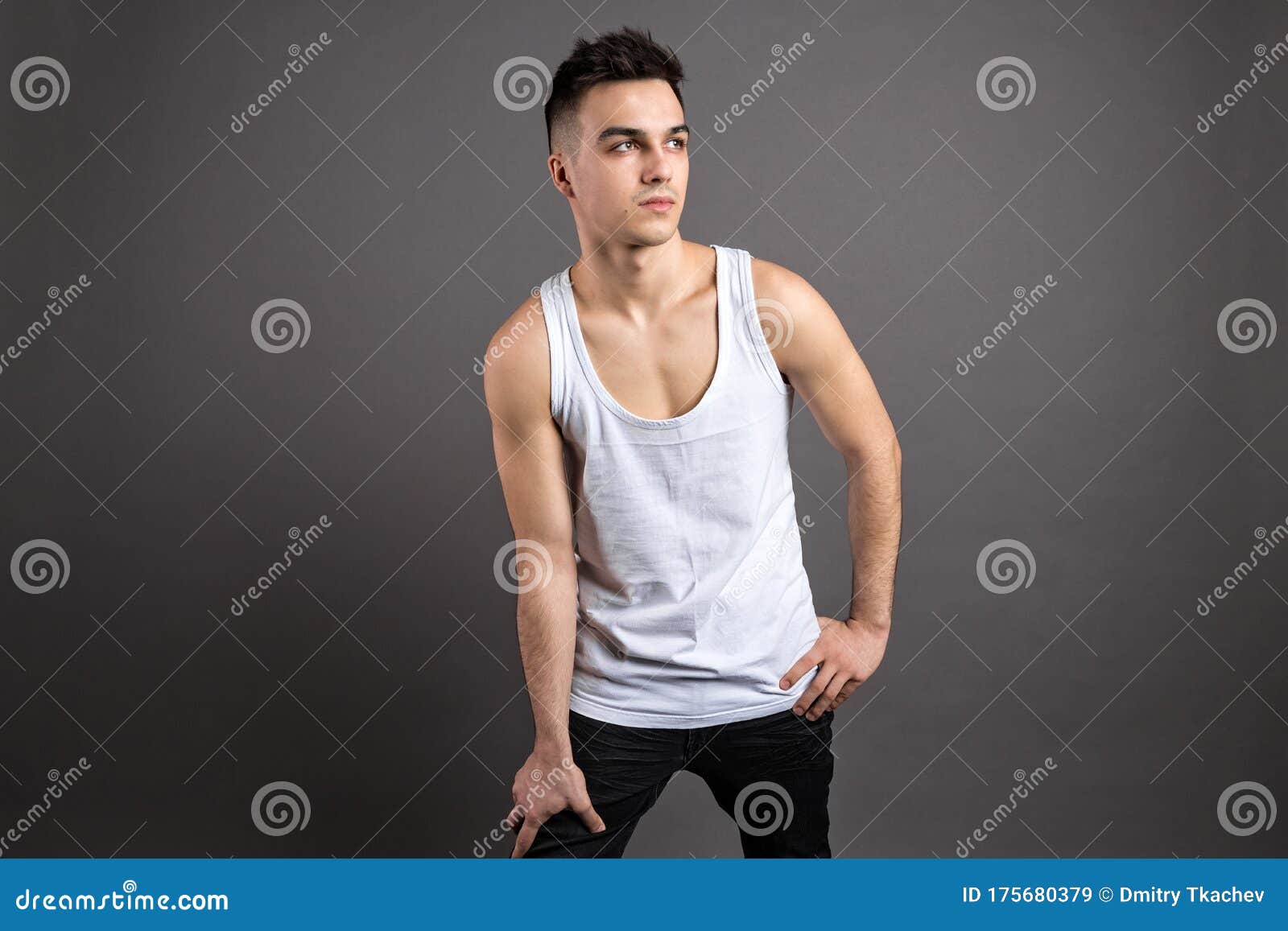 Young Serious Man Posing in Studio. Gray Background Stock Image - Image ...