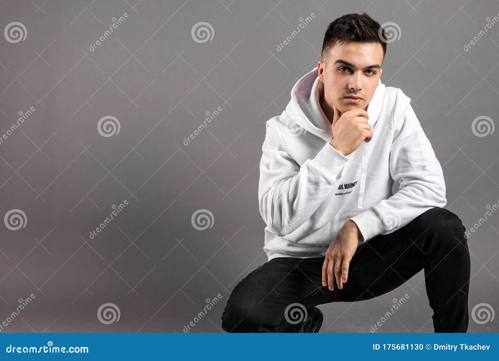 Young Serious Man Posing in Studio. Gray Background Stock Photo - Image ...