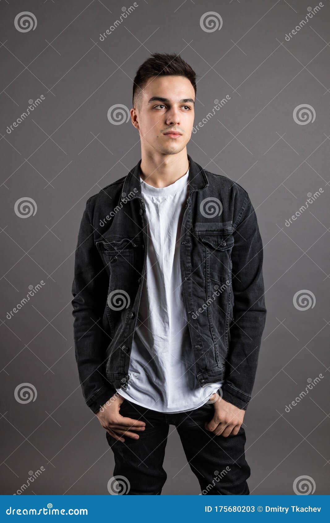 Young Serious Man Posing in Studio. Gray Background Stock Image - Image ...