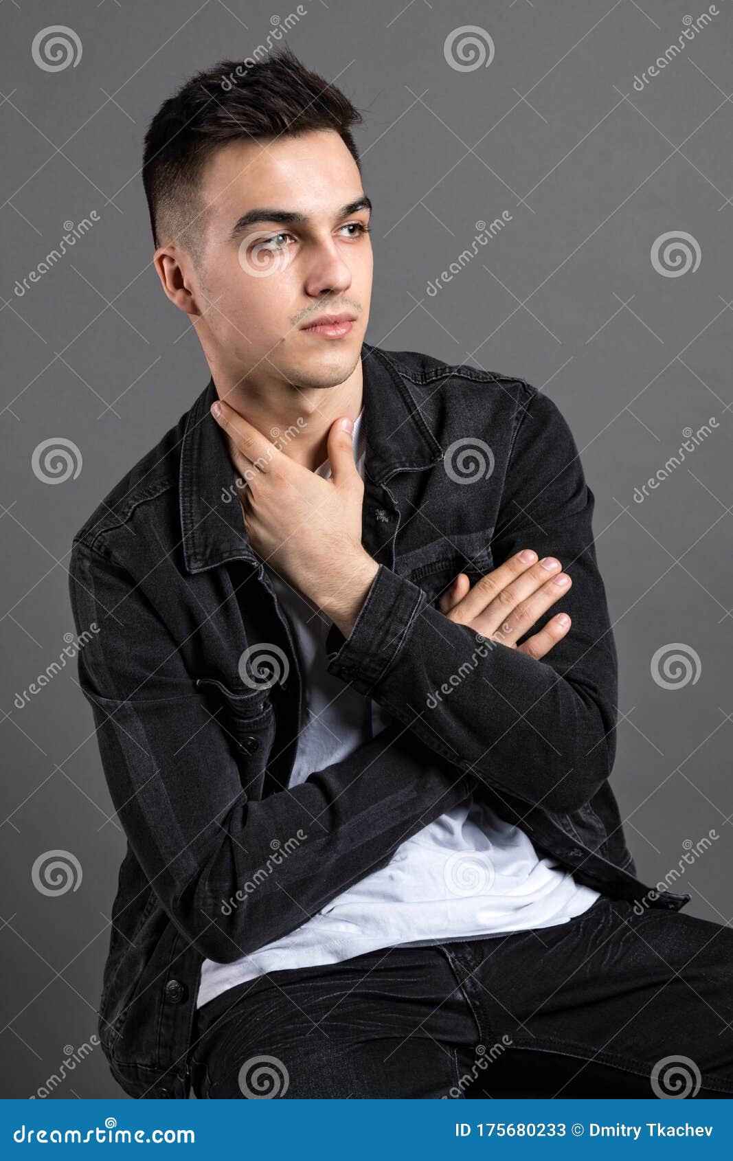 Young Serious Man Posing in Studio. Gray Background Stock Image - Image ...