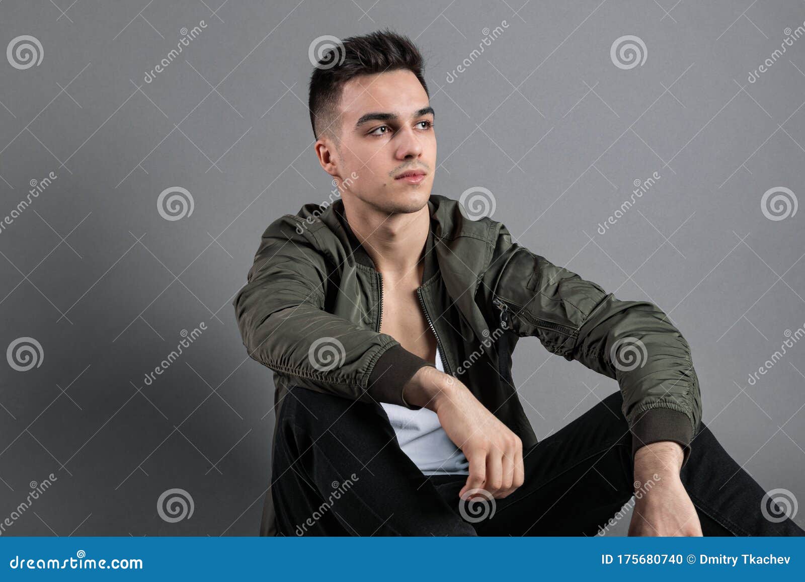 Young Serious Man Posing in Studio. Gray Background Stock Photo - Image ...