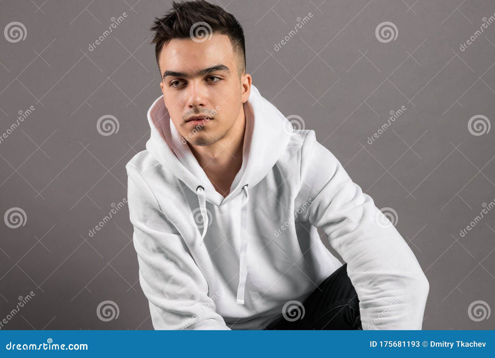 Young Serious Man Posing in Studio. Gray Background Stock Image - Image ...