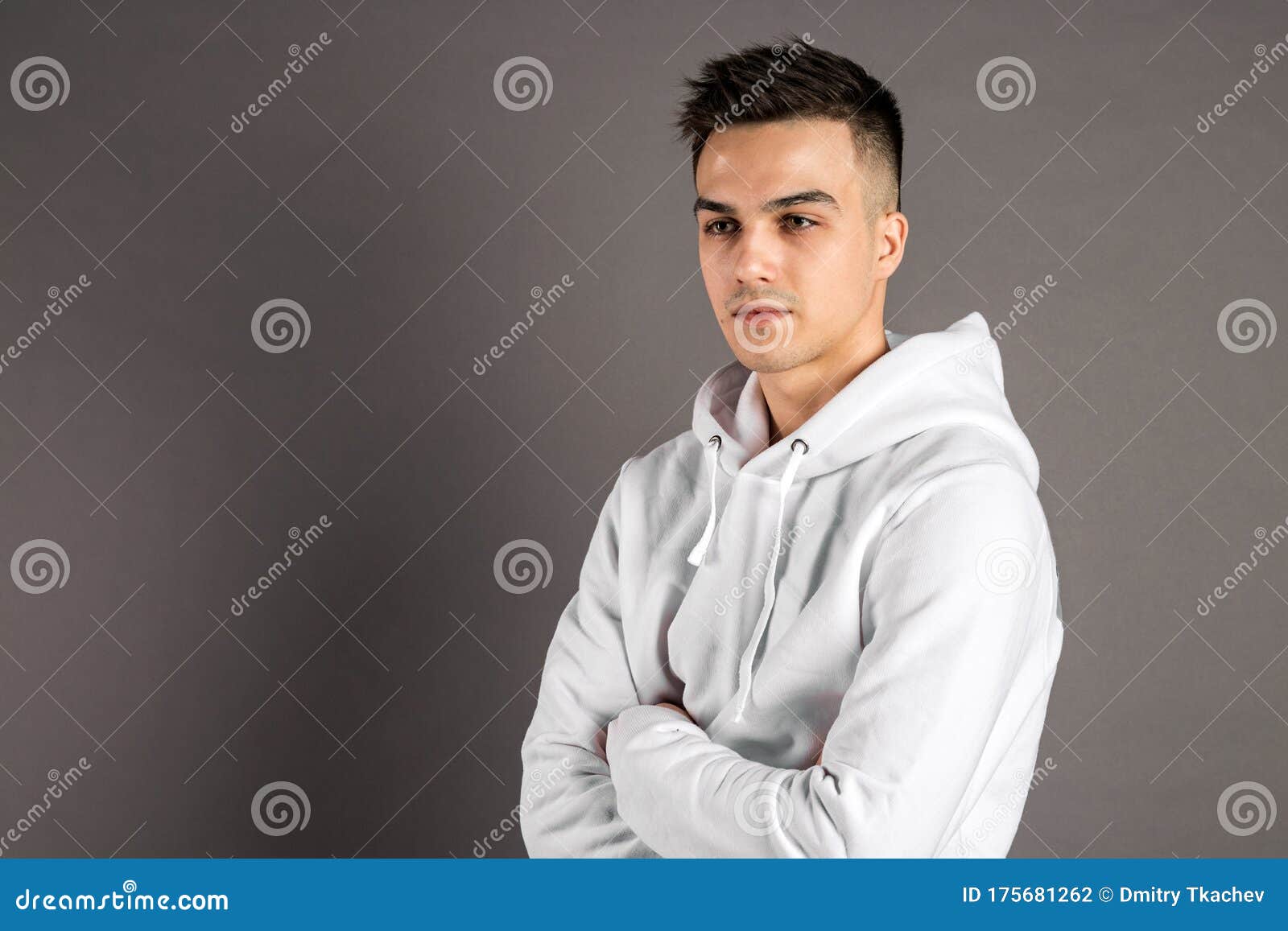 Young Serious Man Posing in Studio. Gray Background Stock Photo - Image ...
