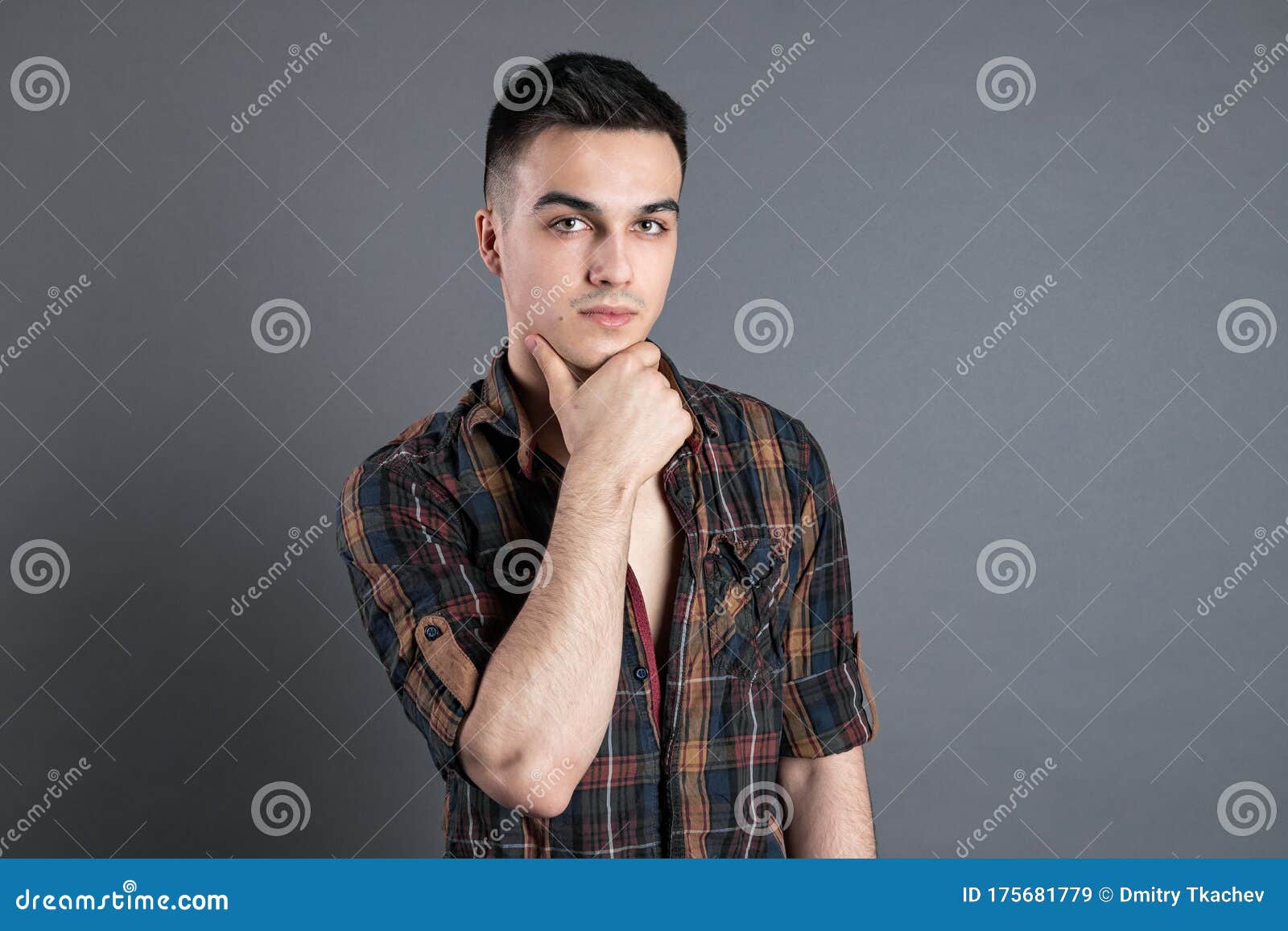 Young Serious Man Posing in Studio. Gray Background Stock Image - Image ...