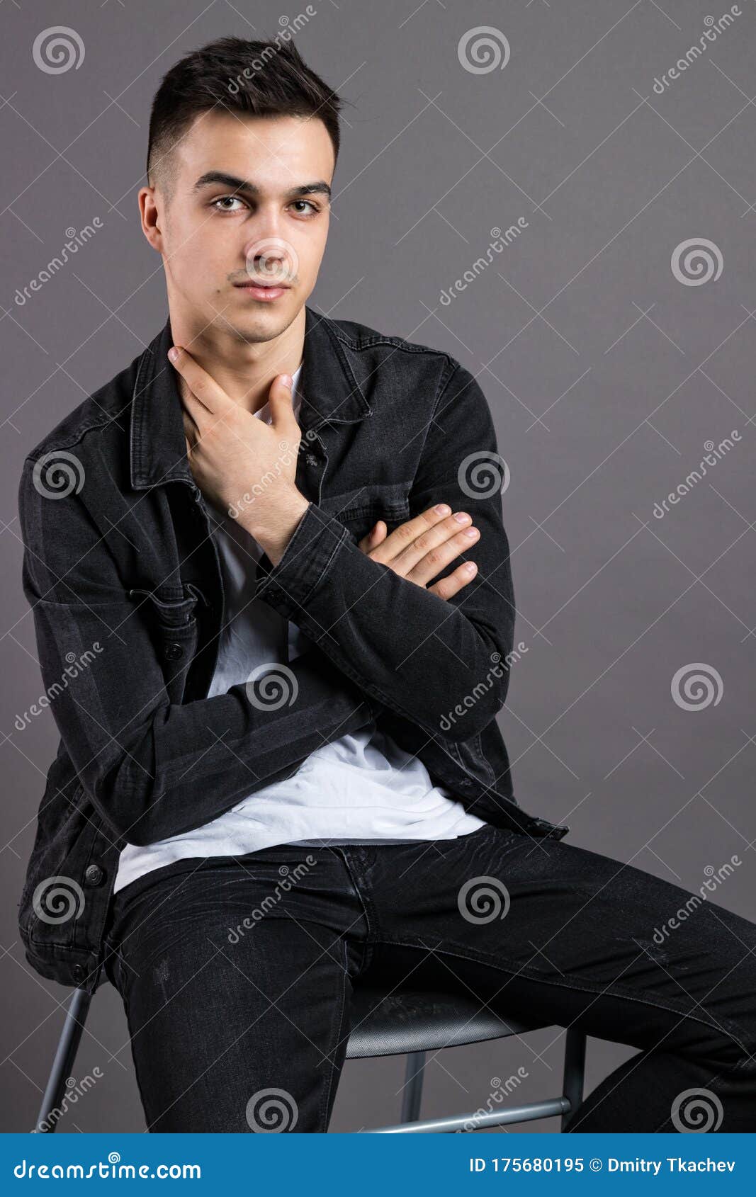 Young Serious Man Posing in Studio. Gray Background Stock Image - Image ...