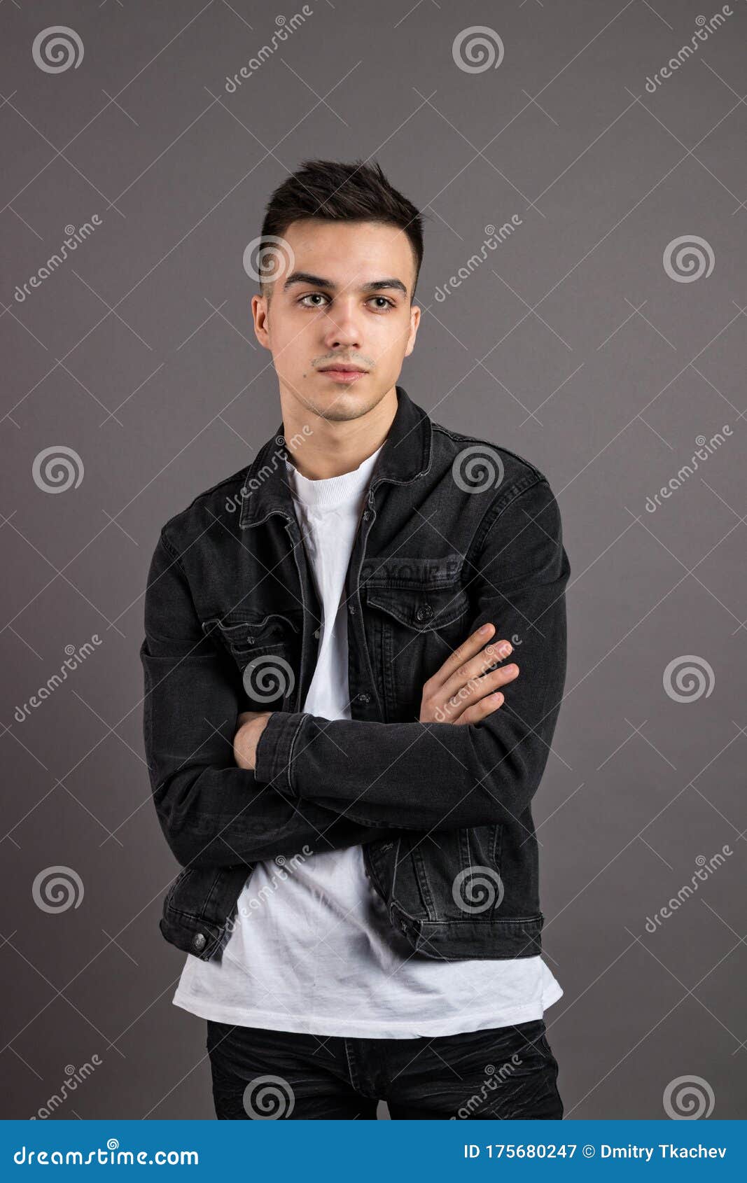 Young Serious Man Posing in Studio. Gray Background Stock Image - Image ...