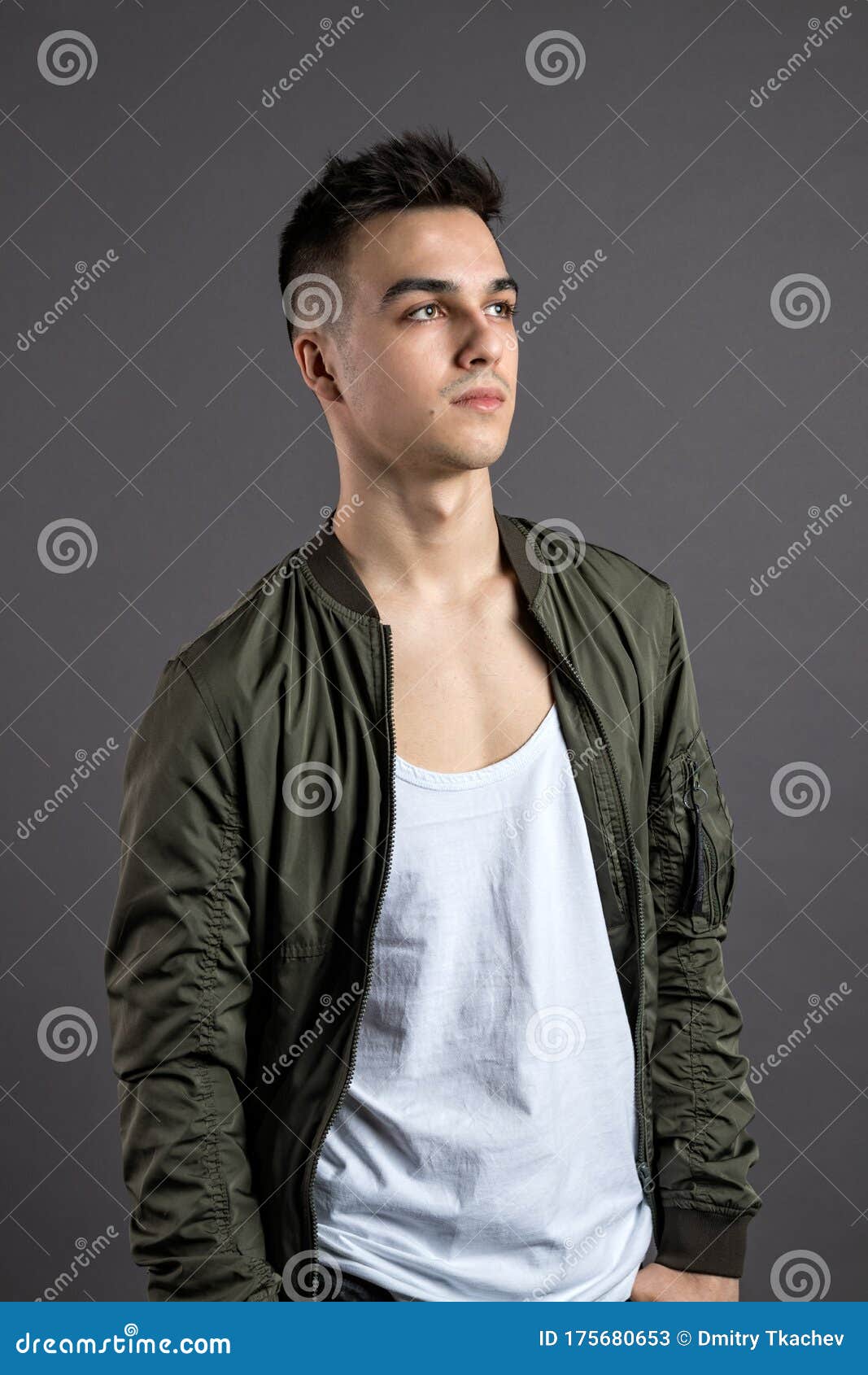 Young Serious Man Posing in Studio. Gray Background Stock Image - Image ...