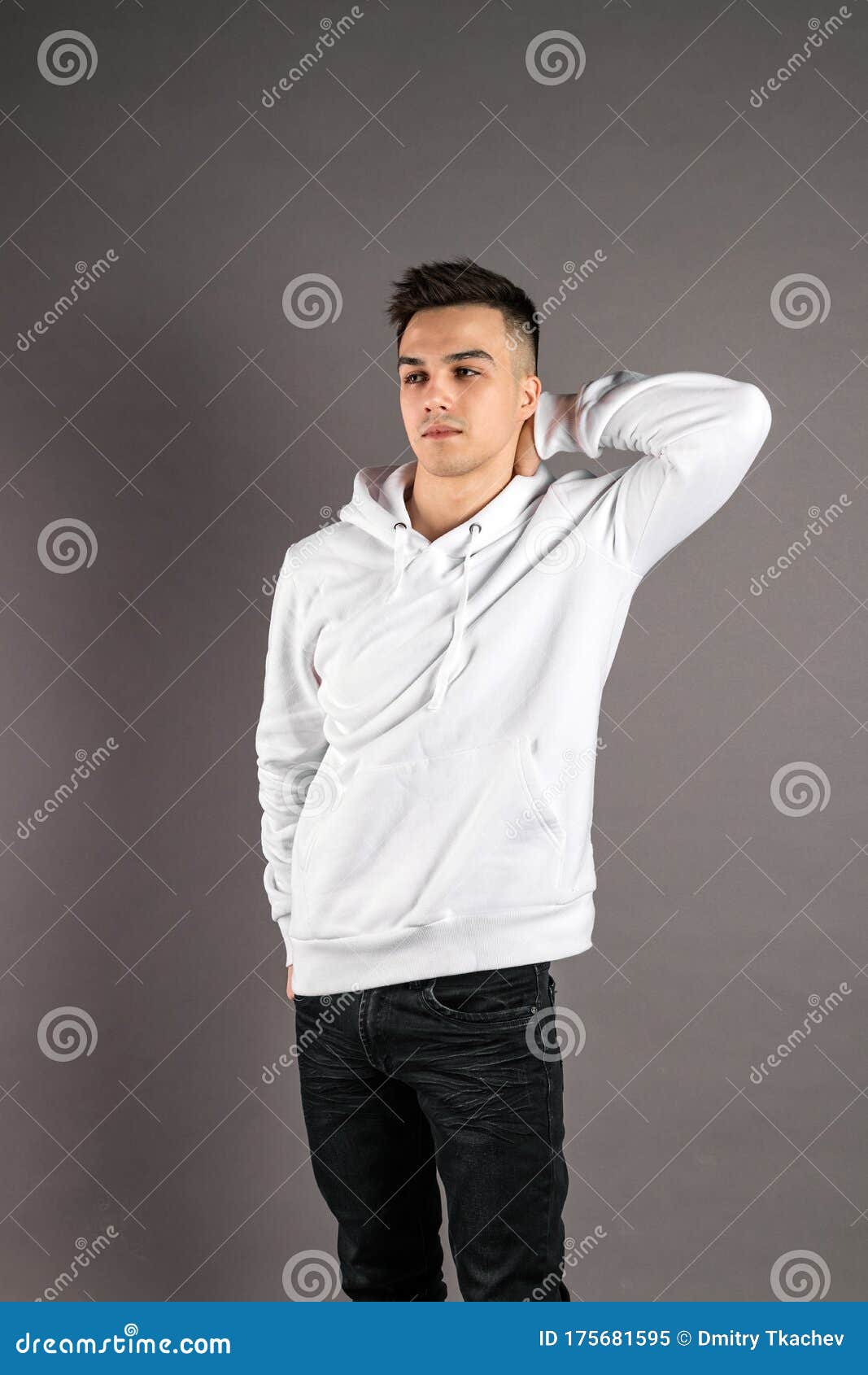 Young Serious Man Posing in Studio. Gray Background Stock Image - Image ...