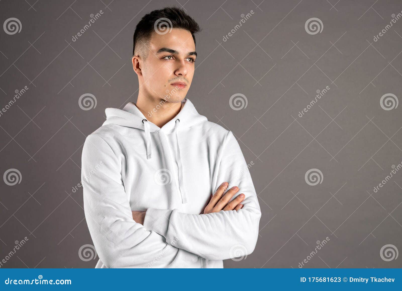 Young Serious Man Posing in Studio. Gray Background Stock Image - Image ...