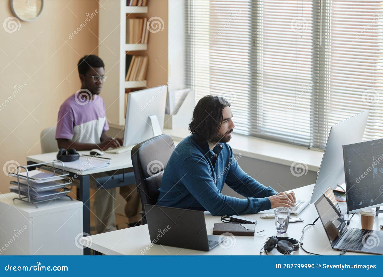 Young Serious Man Pressing Keys of Computer Keyboard by Workplace Stock ...