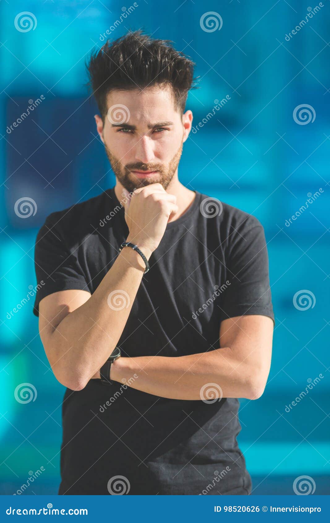 Young Serious Man Propping Chin on Hand Stock Photo - Image of male ...