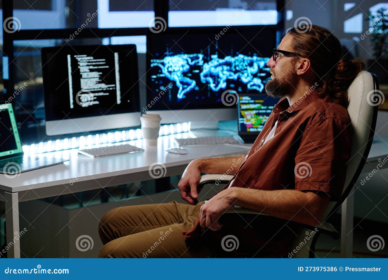Young Serious it Programmer Sitting in Armchair by Workplace Stock ... Young Serious it Programmer Sitting in Armchair by Workplace Stock ...